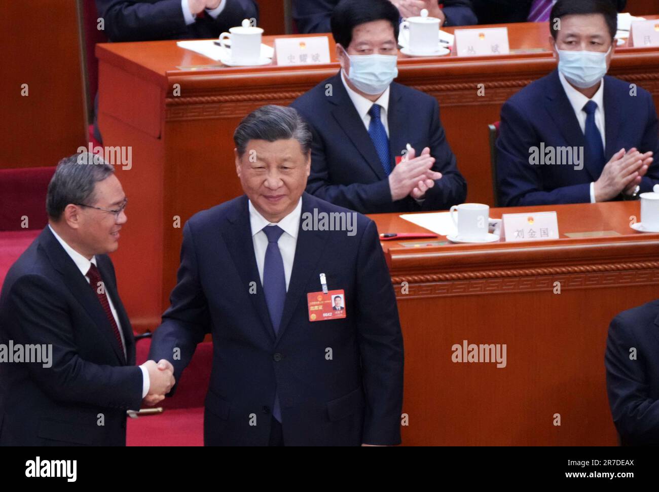 FILE: Chinese President Xi Jinping shakes hands with Li Qiang (L ...