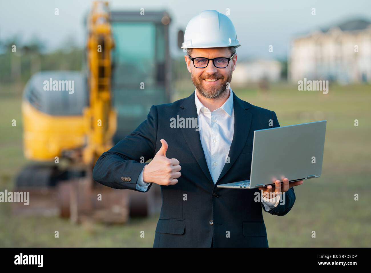 Construction business owner. Man in suit and hardhat halmet at building ...