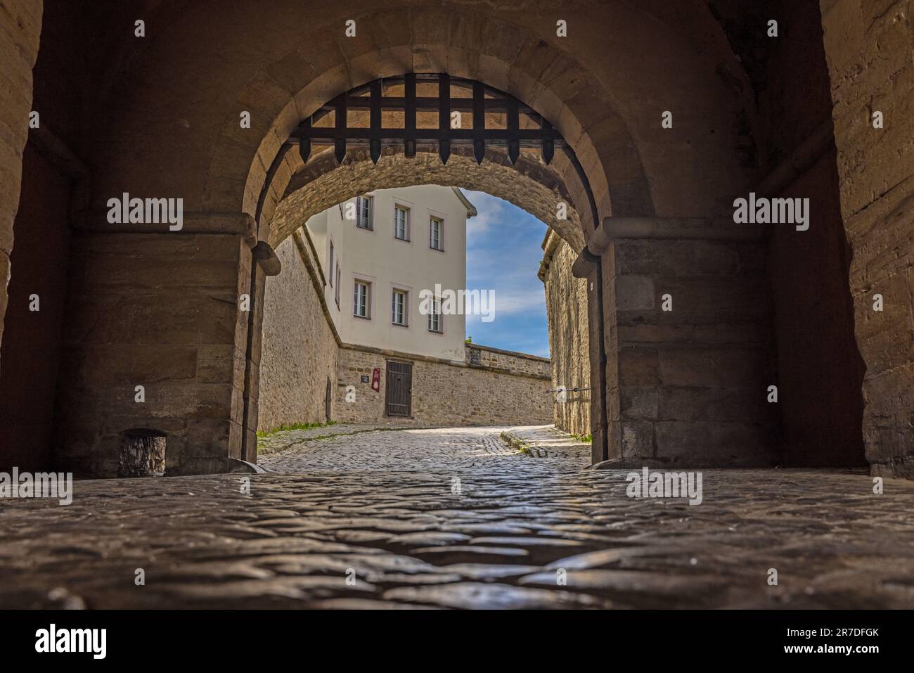 View through a historical archway of a Middle Ages castle in daylight ...