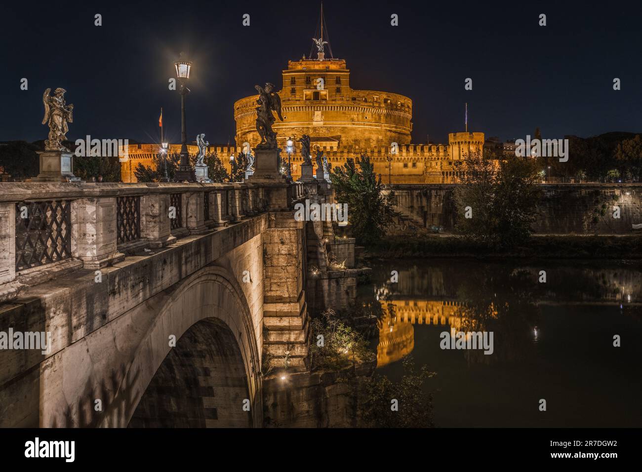 A night view of Castel Sant'Angelo on the bank of the Tiber River in ...