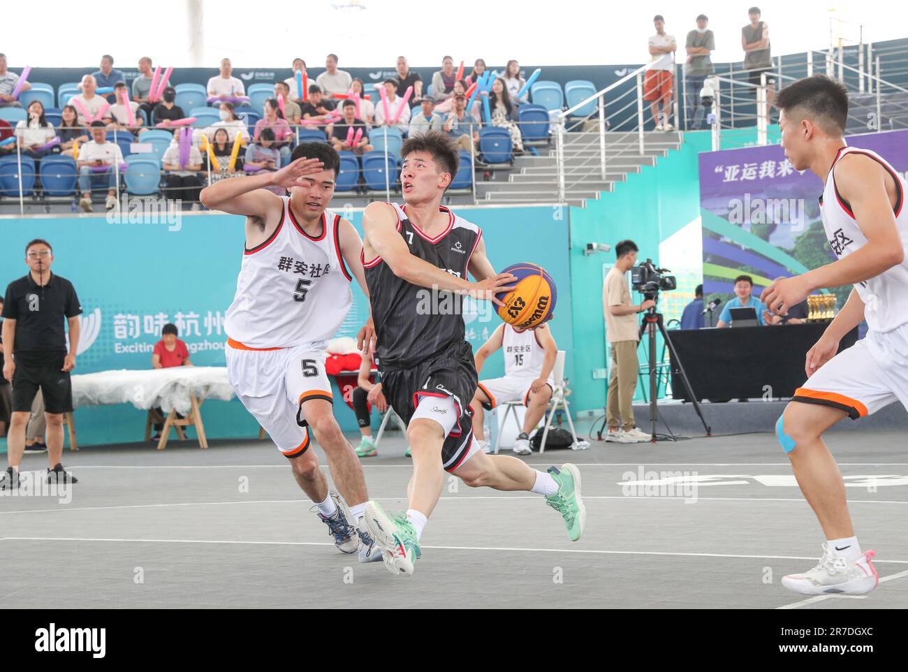 HUZHOU, CHINA - JUNE 15, 2023 - Players compete at a basketball court ...