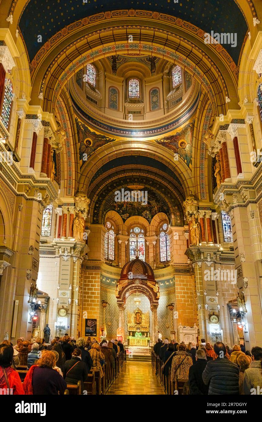 Oviedo, Spain - February 12, 2023: A church congregation stand in the ...