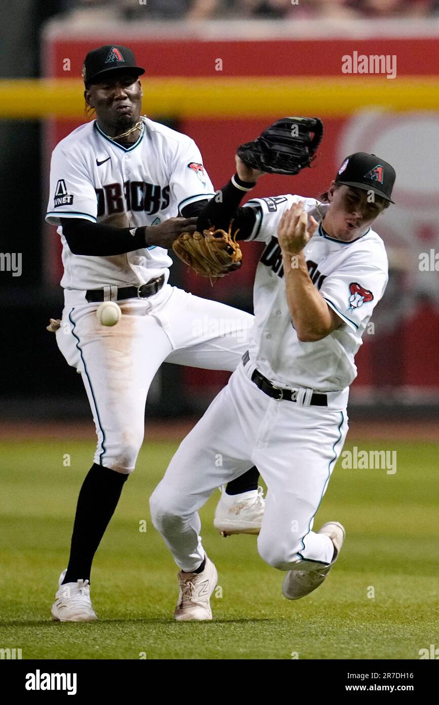 Arizona Diamondbacks right fielder Jake McCarthy, right, makes a ...