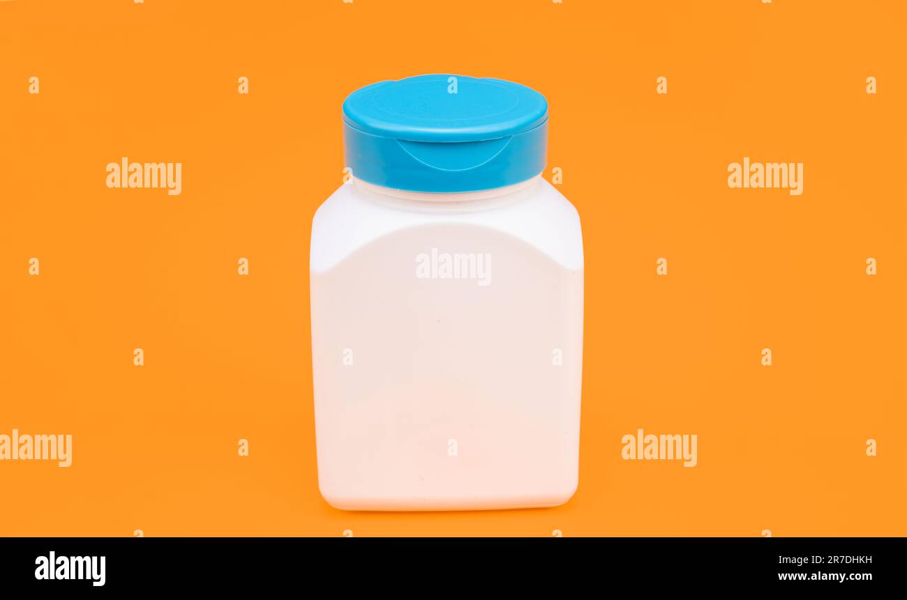 multivitamin bottle on yellow background. food supplement Stock Photo ...