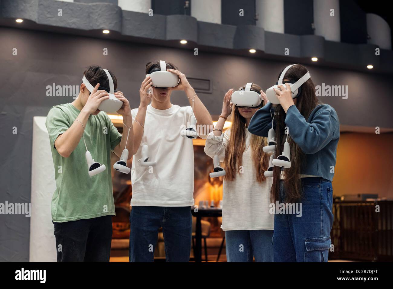 A group of four teenagers interacting and playing games using Virtual ...