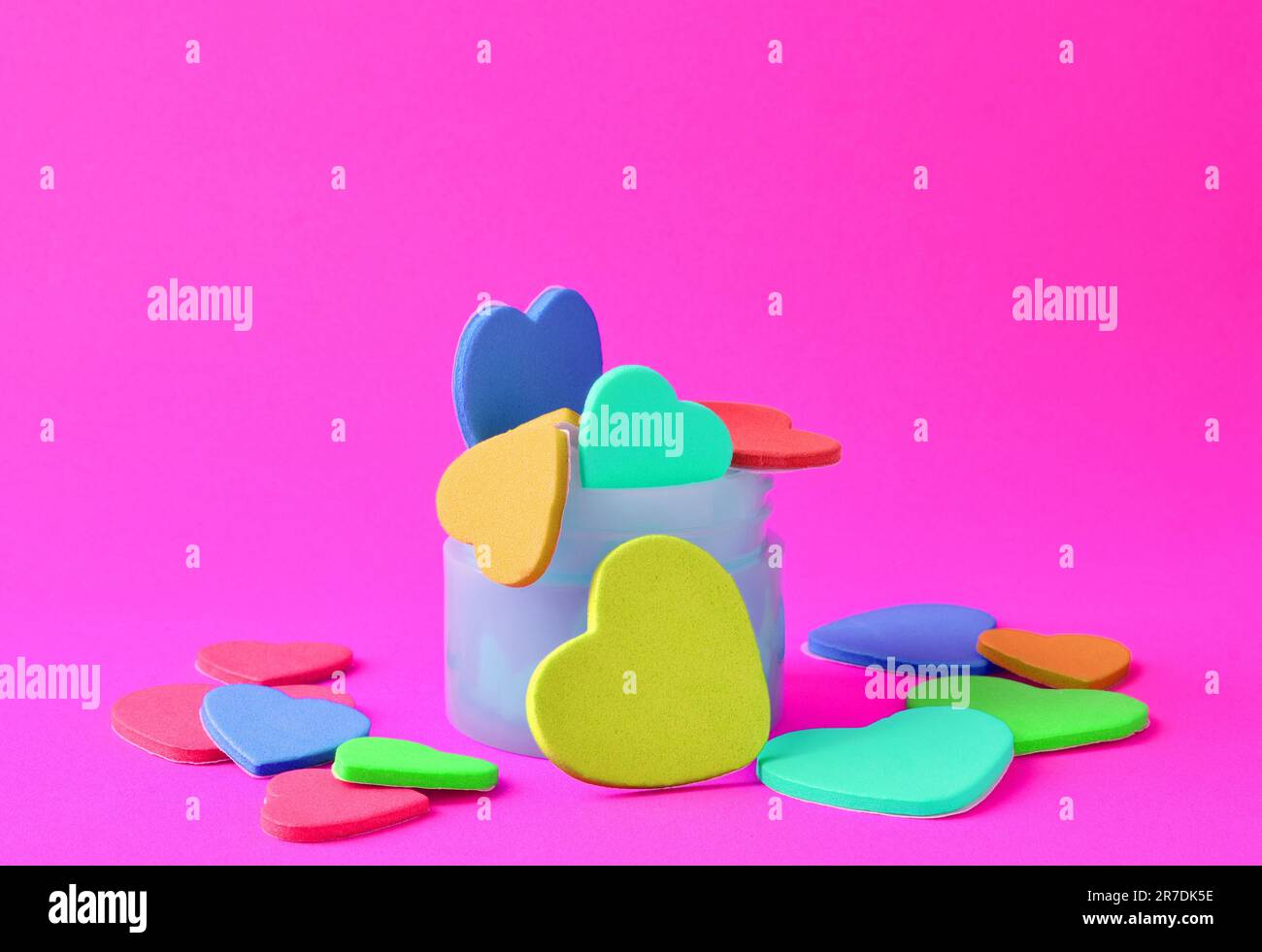 A bucket full of colorful heart-shapes perfect for adding a touch of ...