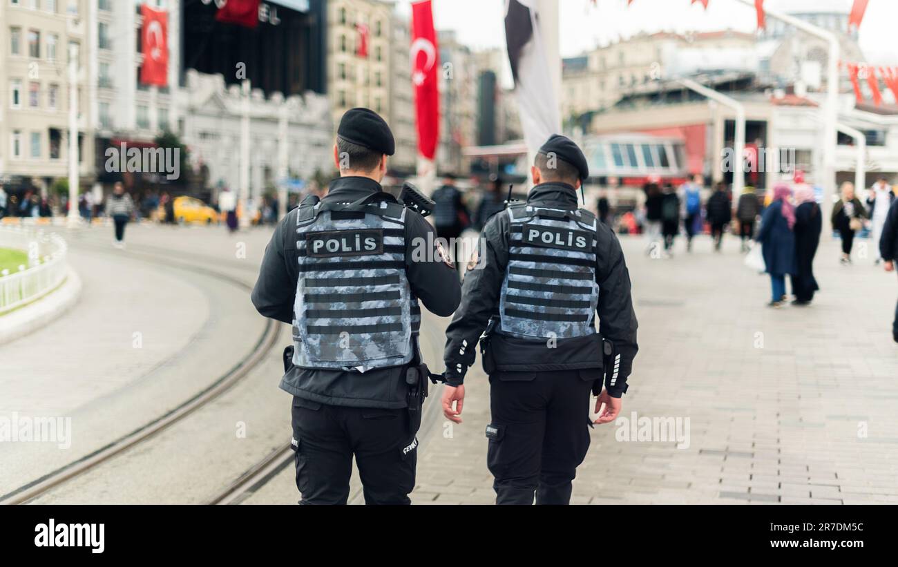 Policemen walking hi-res stock photography and images - Alamy