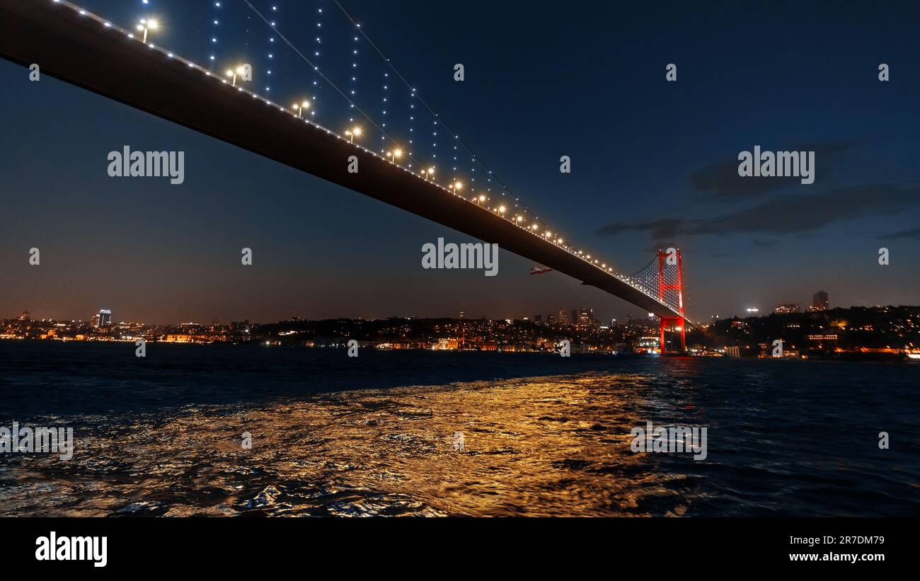 Bosphorus Bridge at night in Istanbul, Turkey. City in the background ...