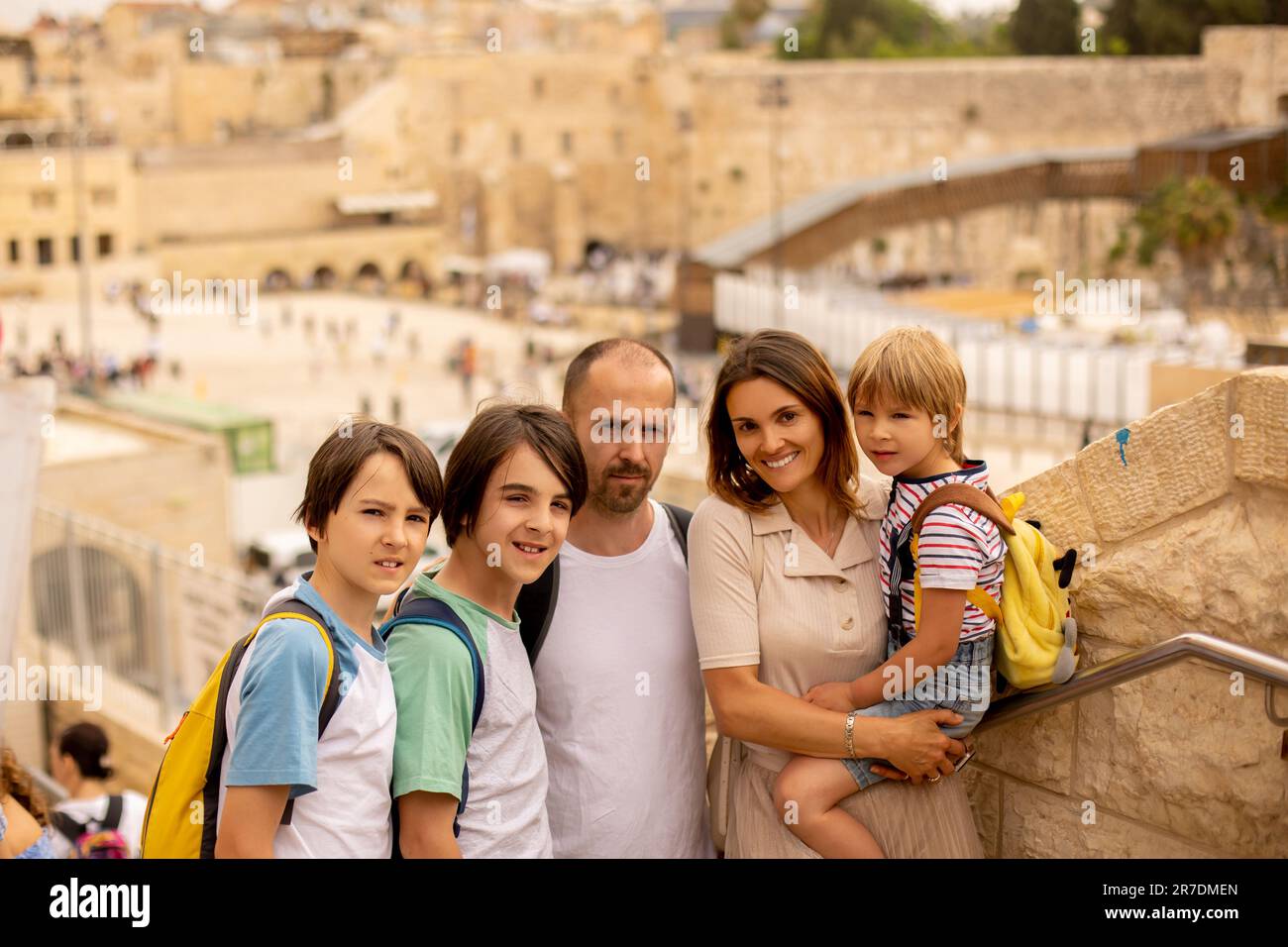 European tourist family with children, visiting Jerusalem, meeting new ...