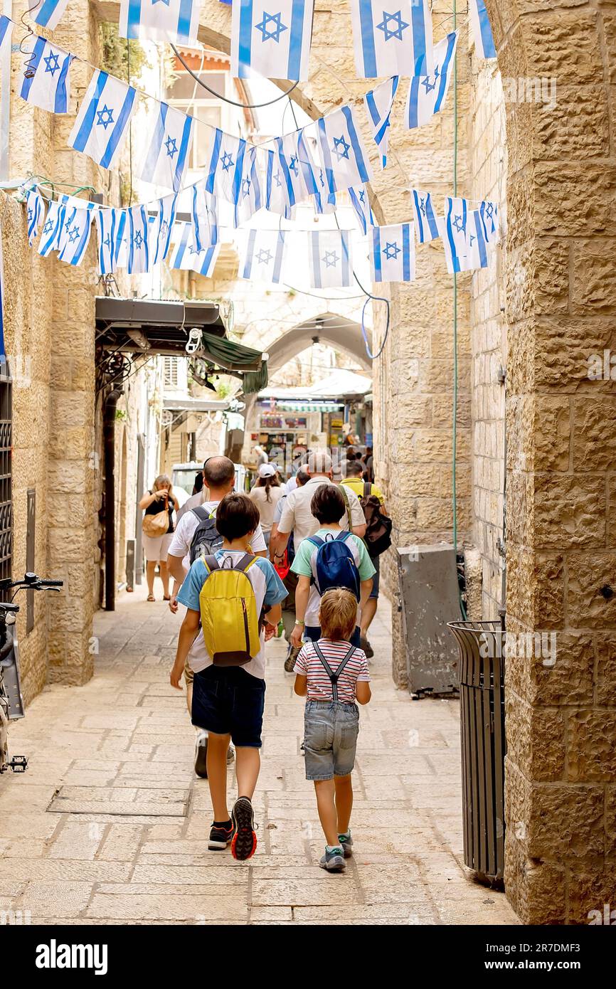 European tourist family with children, visiting Jerusalem, meeting new ...