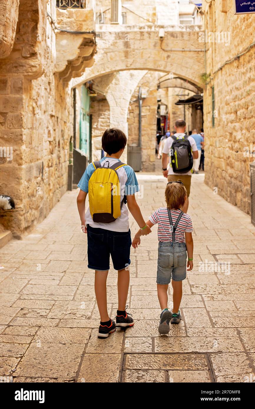 European tourist family with children, visiting Jerusalem, meeting new ...