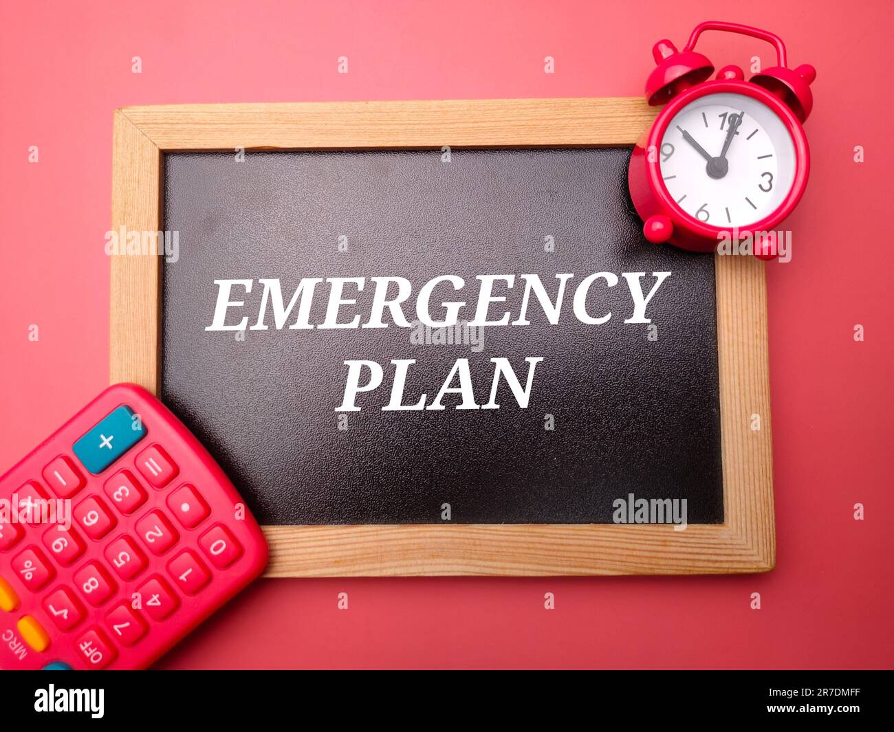 A chalkboard featuring the phrase Emergency Plan written in white chalk ...