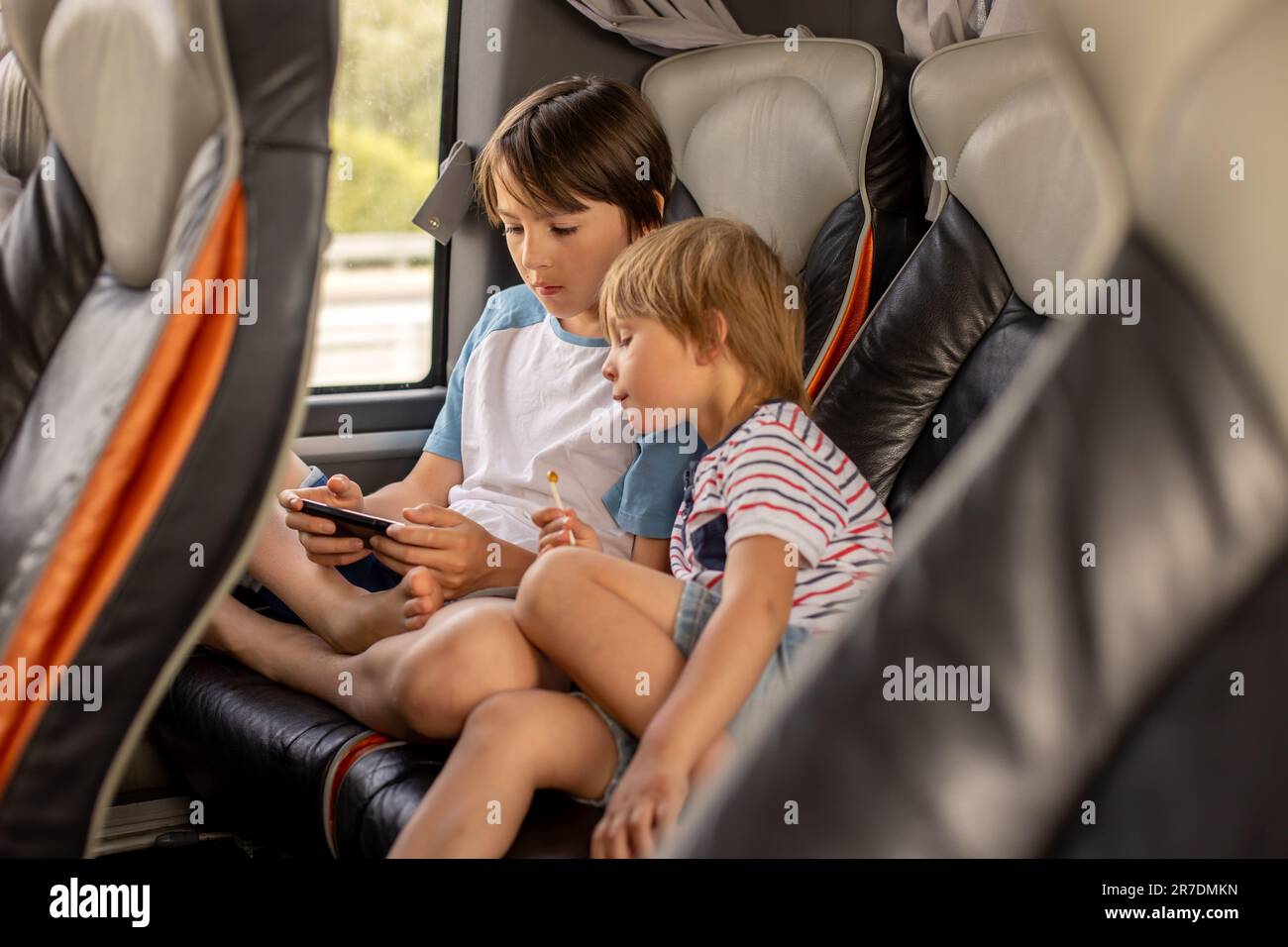 Children sit on bus hi-res stock photography and images - Alamy