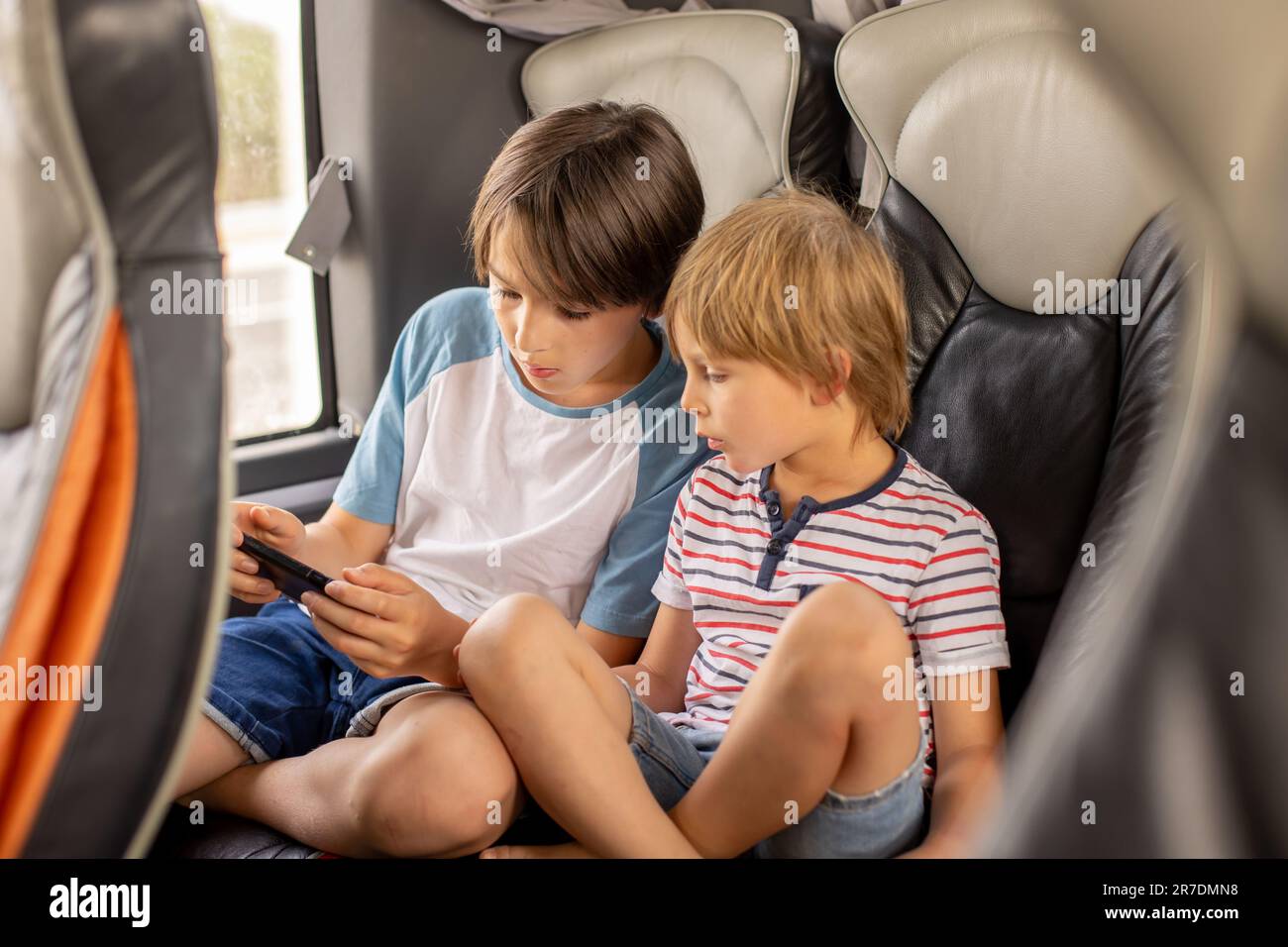 Children sit on bus hi-res stock photography and images - Alamy