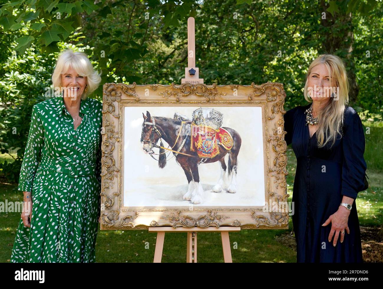 Queen Camilla is presented with an oil painting by artist Mandy ...