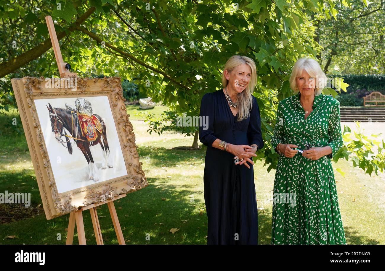 Queen Camilla is presented with an oil painting by artist Mandy ...