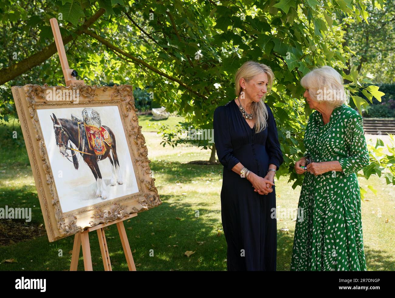 Queen Camilla is presented with an oil painting by artist Mandy ...