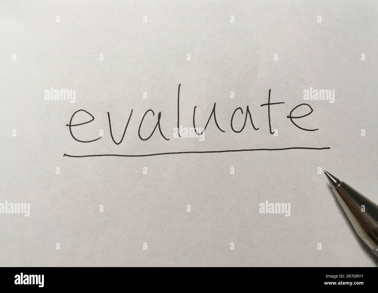 Evaluate concept word on paper background Stock Photo - Alamy
