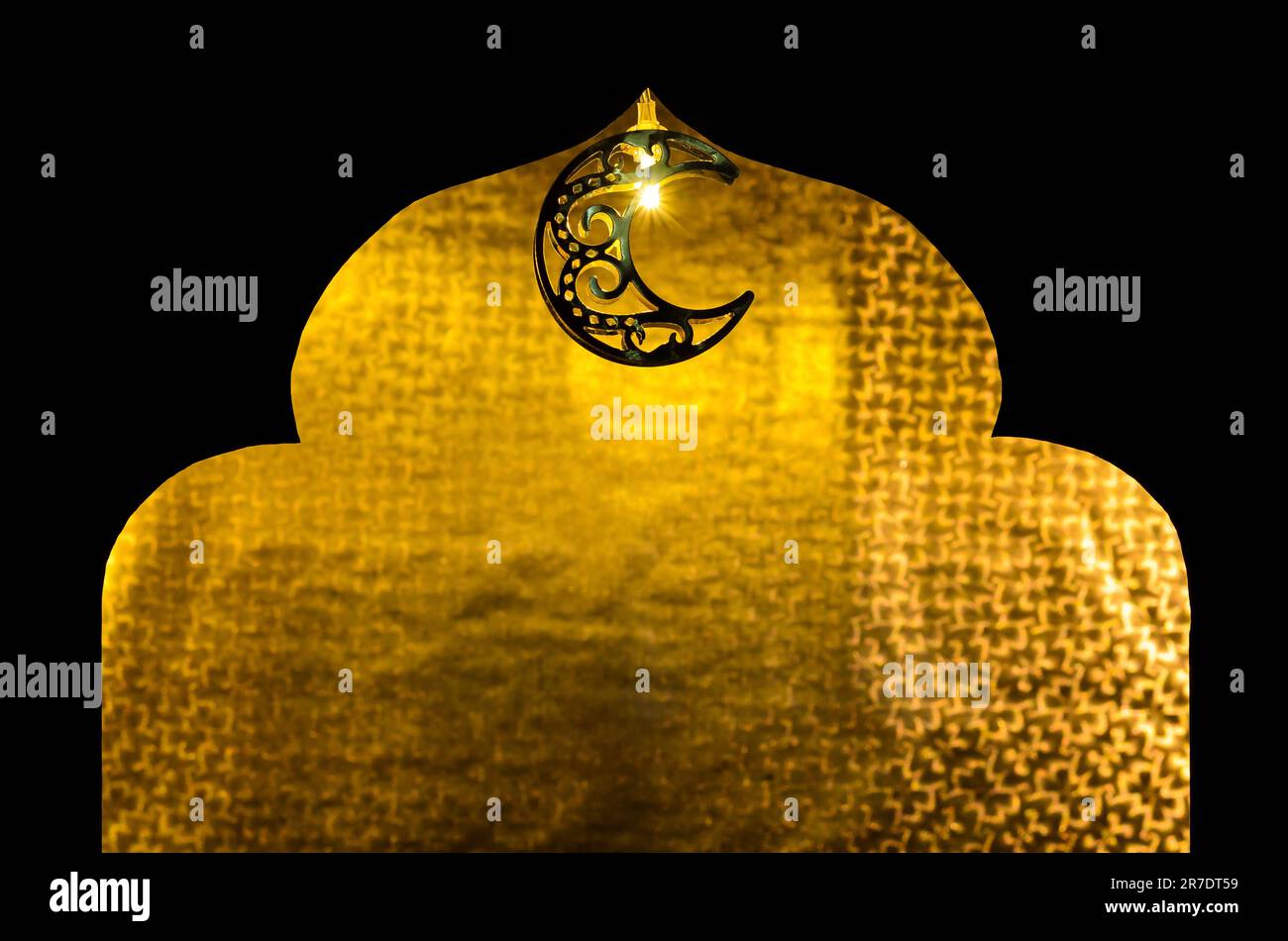 Decorated moon shape light hanging on top of black paper cut in mosque ...