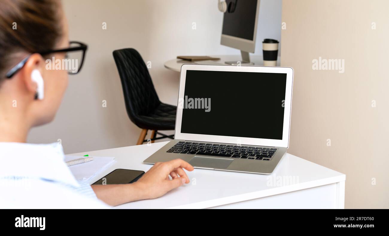 Woman white collar worker using laptop for corporate online meeting ...