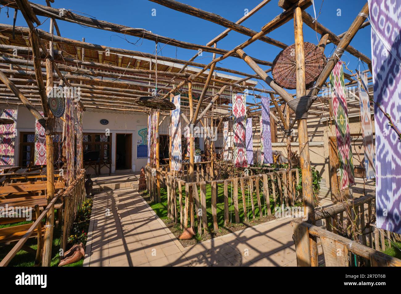 Various swatches of the traditional ikat style fabric, textile hang in ...