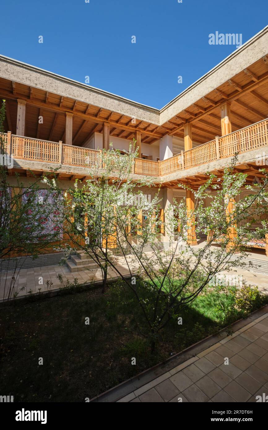 The inner courtyard with garden trees. At the Mirzakarim Bai house in ...