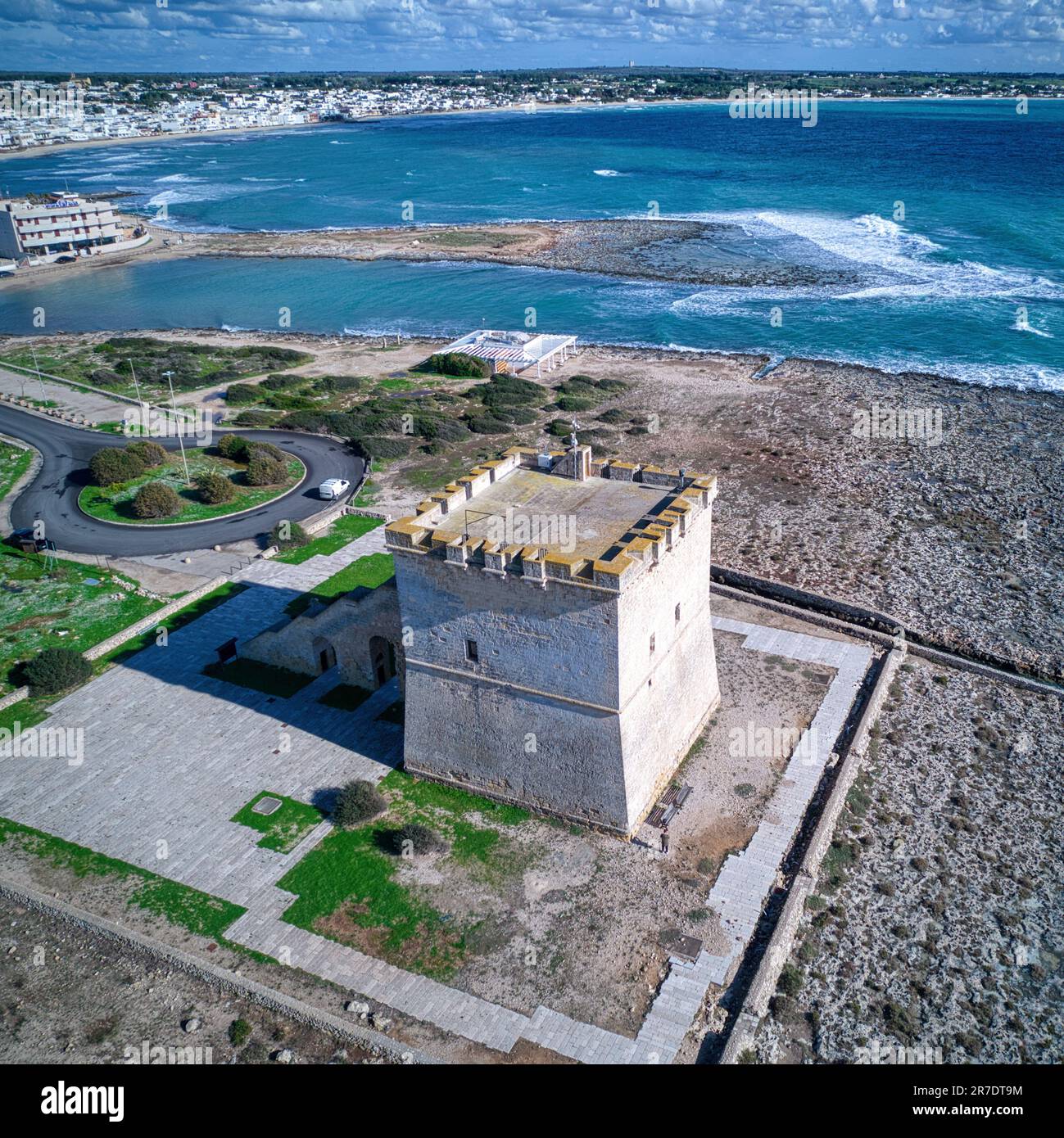 An aerial view of a castle on the coastline of Torre lapillo, Italy ...