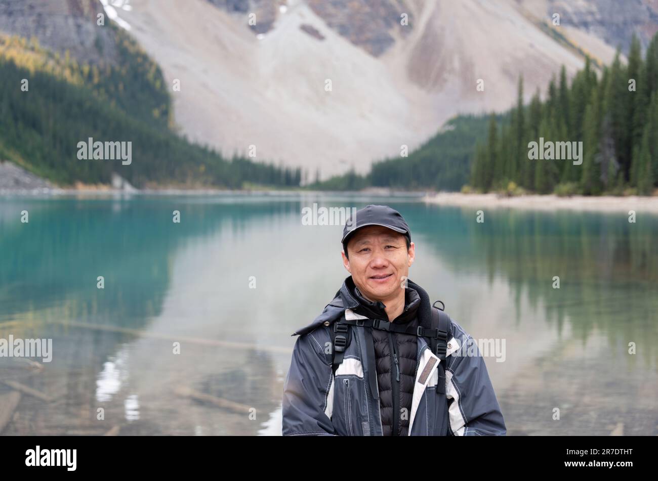 Tourist at Moraine Lake. Hiking Valley of Ten Peaks trail. Banff National Park, Alberta, Canada ...