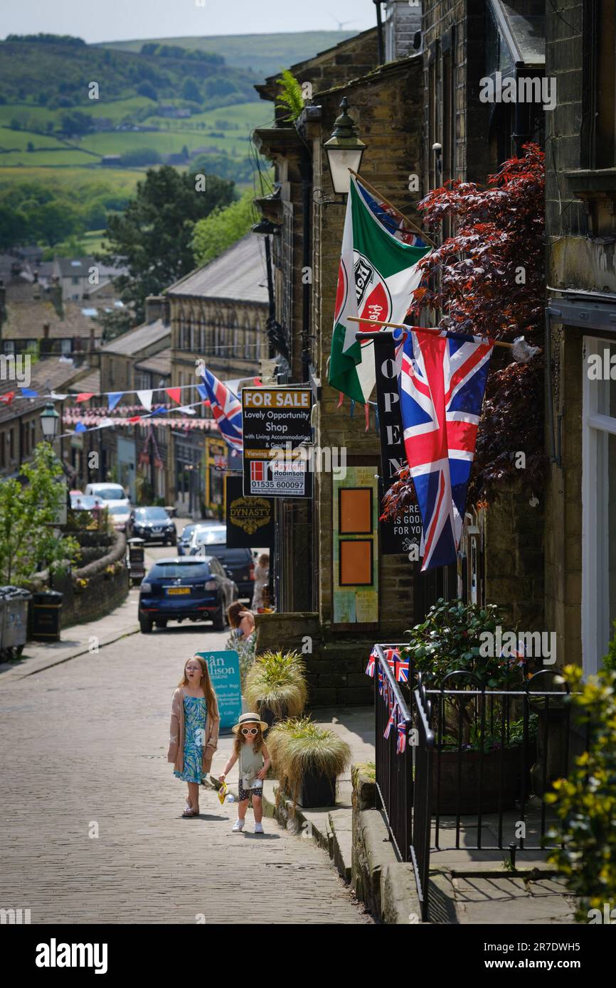 Haworth, West Yorkshire, UK. The view down Main Street in the popular ...