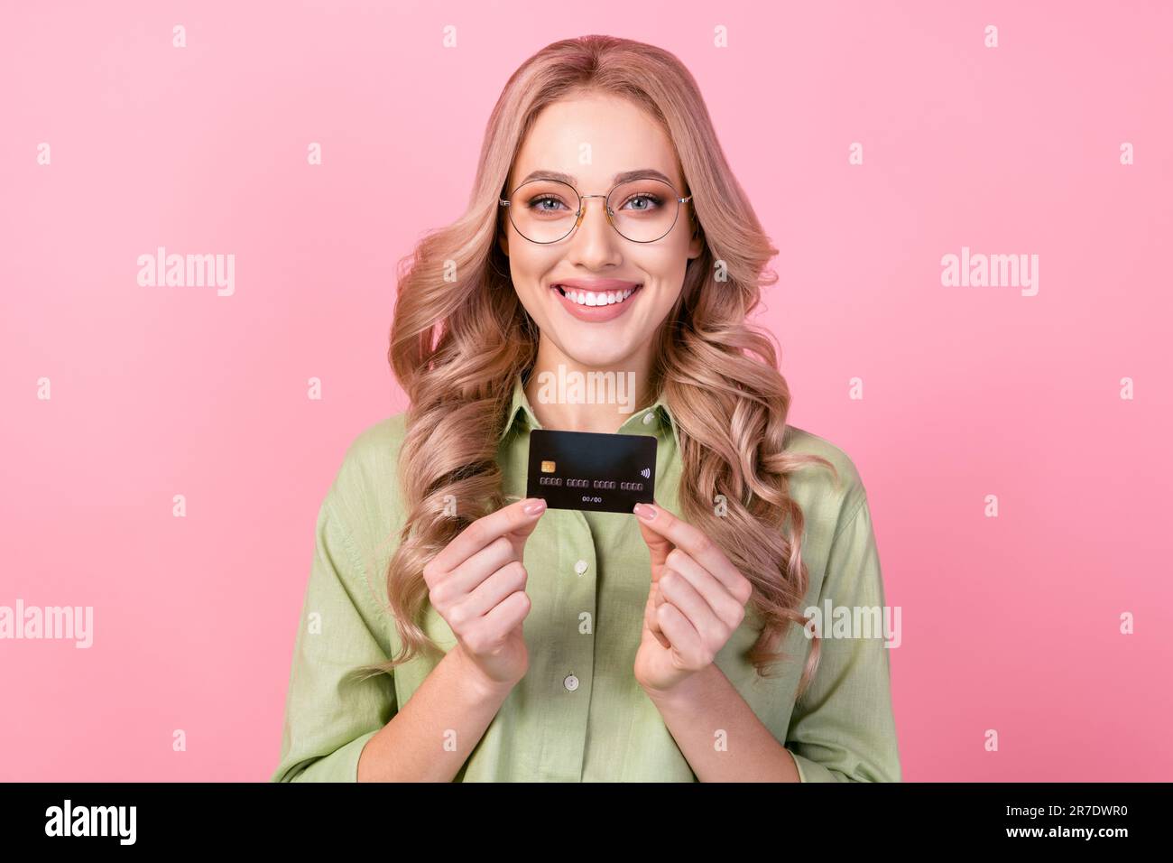 Portrait of positive pretty person toothy smile hands hold showing ...