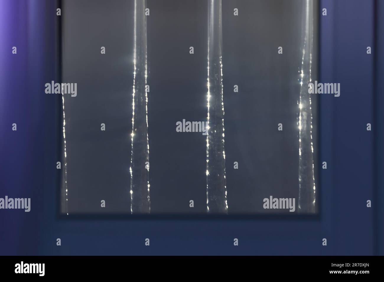 Blurred blue background. Glowing lines. Falling glare. Stream light ...