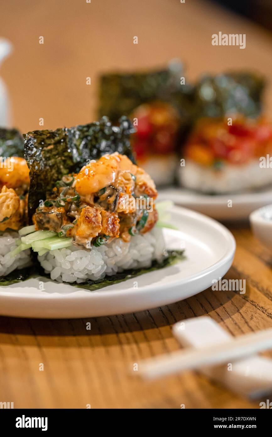 Japanese hand sushi rolls with different fish and sauce Stock Photo - Alamy