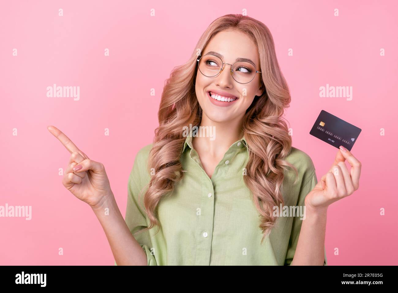 Portrait of charming lady hold debit card look indicate finger empty ...