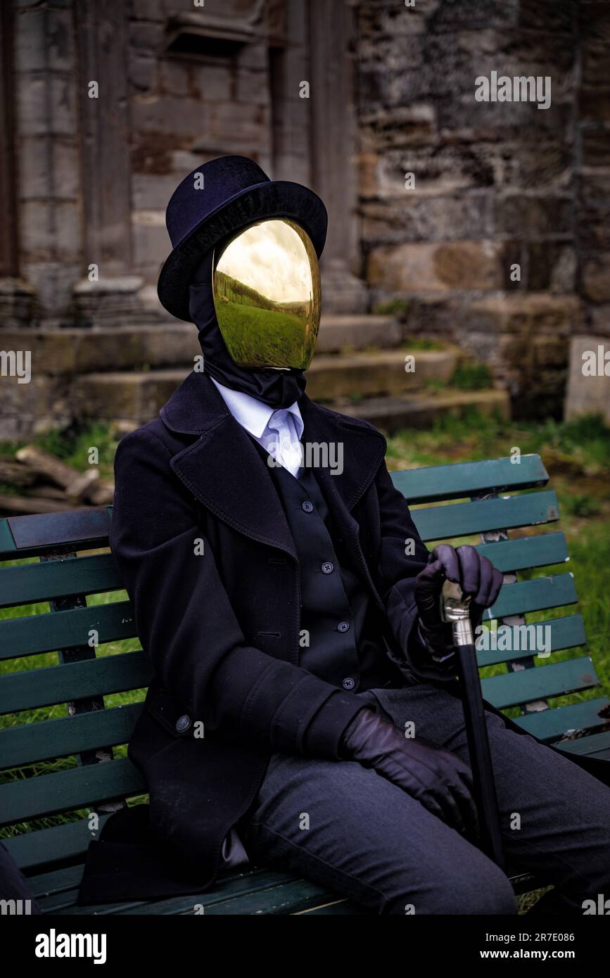 Person dressed as a Victorian gentleman wearing a gold mirrored ...