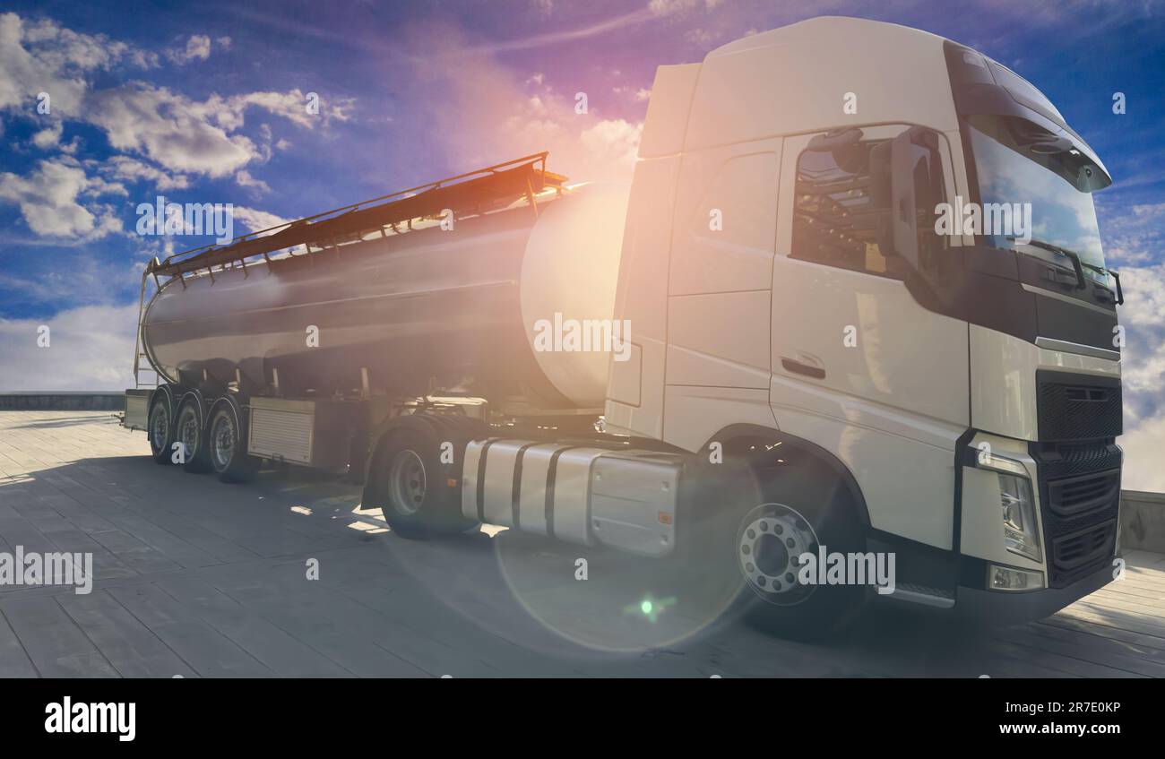 Big fuel gas tanker truck on the roof of building over blue sky. Truck ...