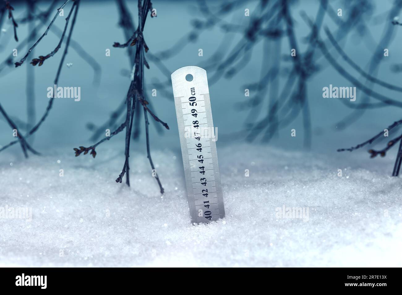 Yardstick measuring the depth of snow.A ruler with a scale placed in ...