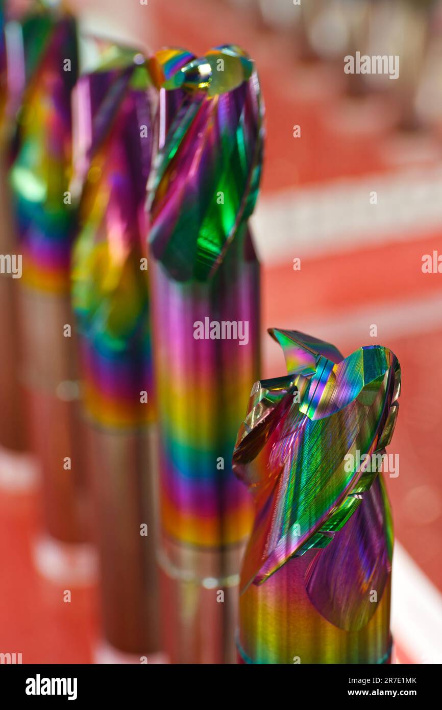 Rainbow multicoloured metalworking tool milling cutter, close-up shot ...