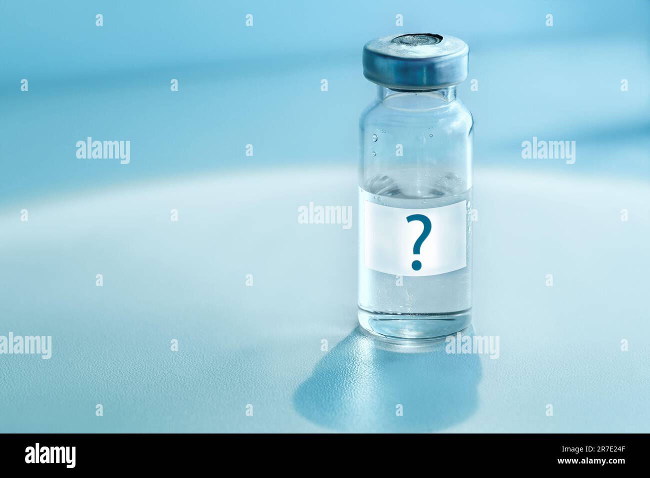 Medical ampoule on a blue background. Vaccination concept. Question ...