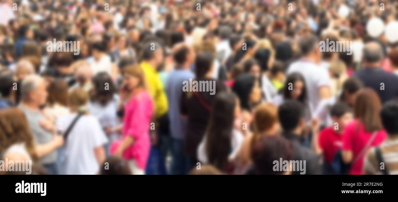 Crowd of people with blurred men and women on busy city street. Blur ...