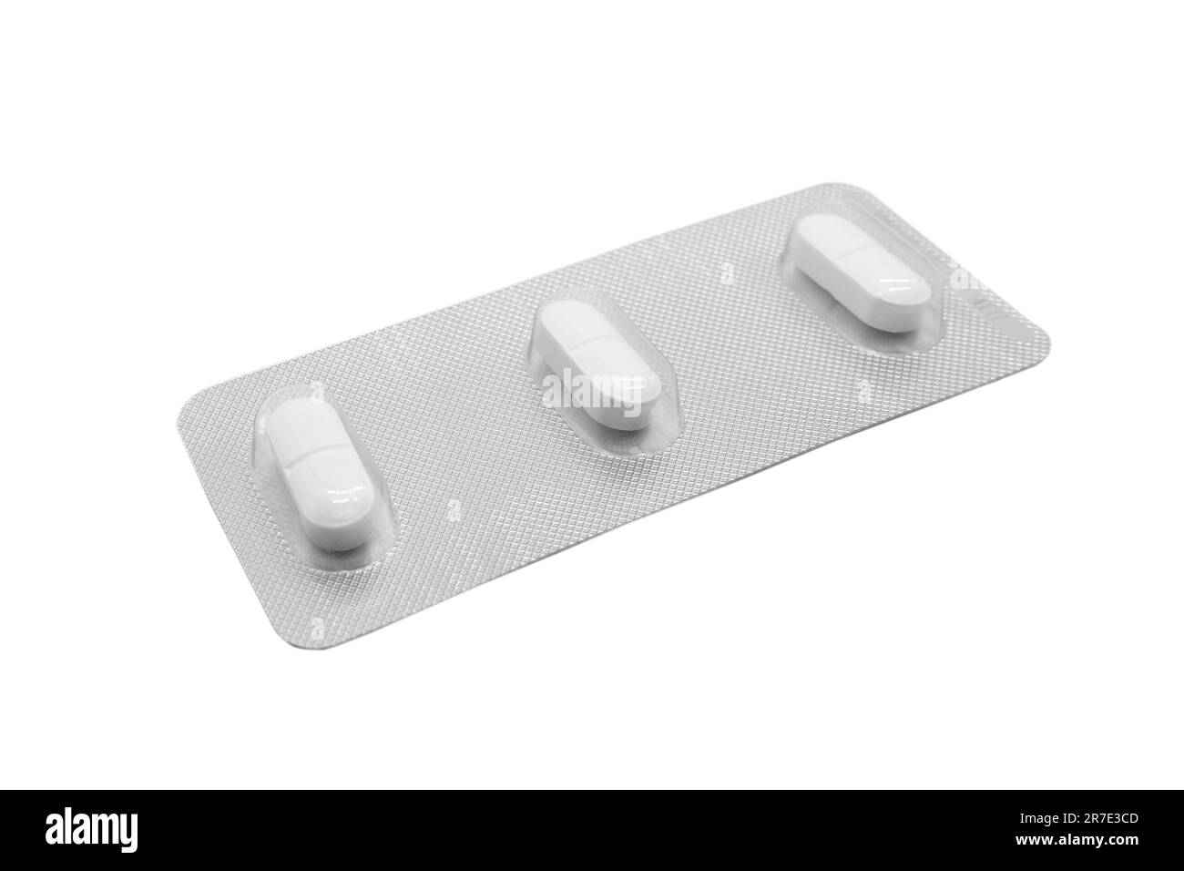 Macro shot pile of tablets pill in silver blister packaging isolated on ...