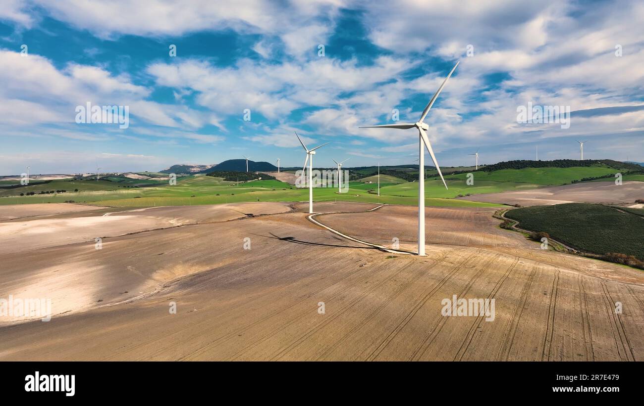 Wind power turbines generating clean renewable energy. Aerial view of ...