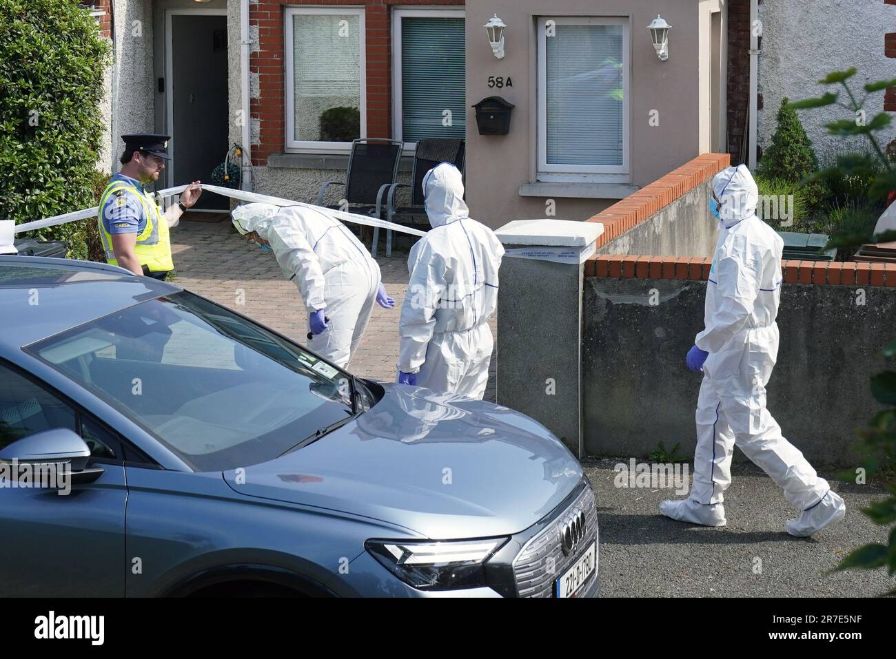 Garda forensics officers at the scene where the body of a woman was ...