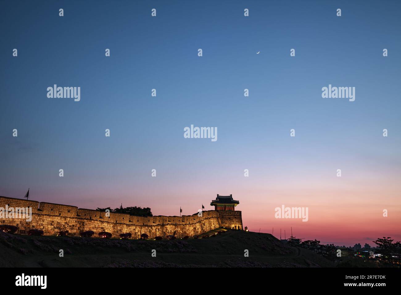 A majestic old fortress stands proudly in the night illuminated by a ...