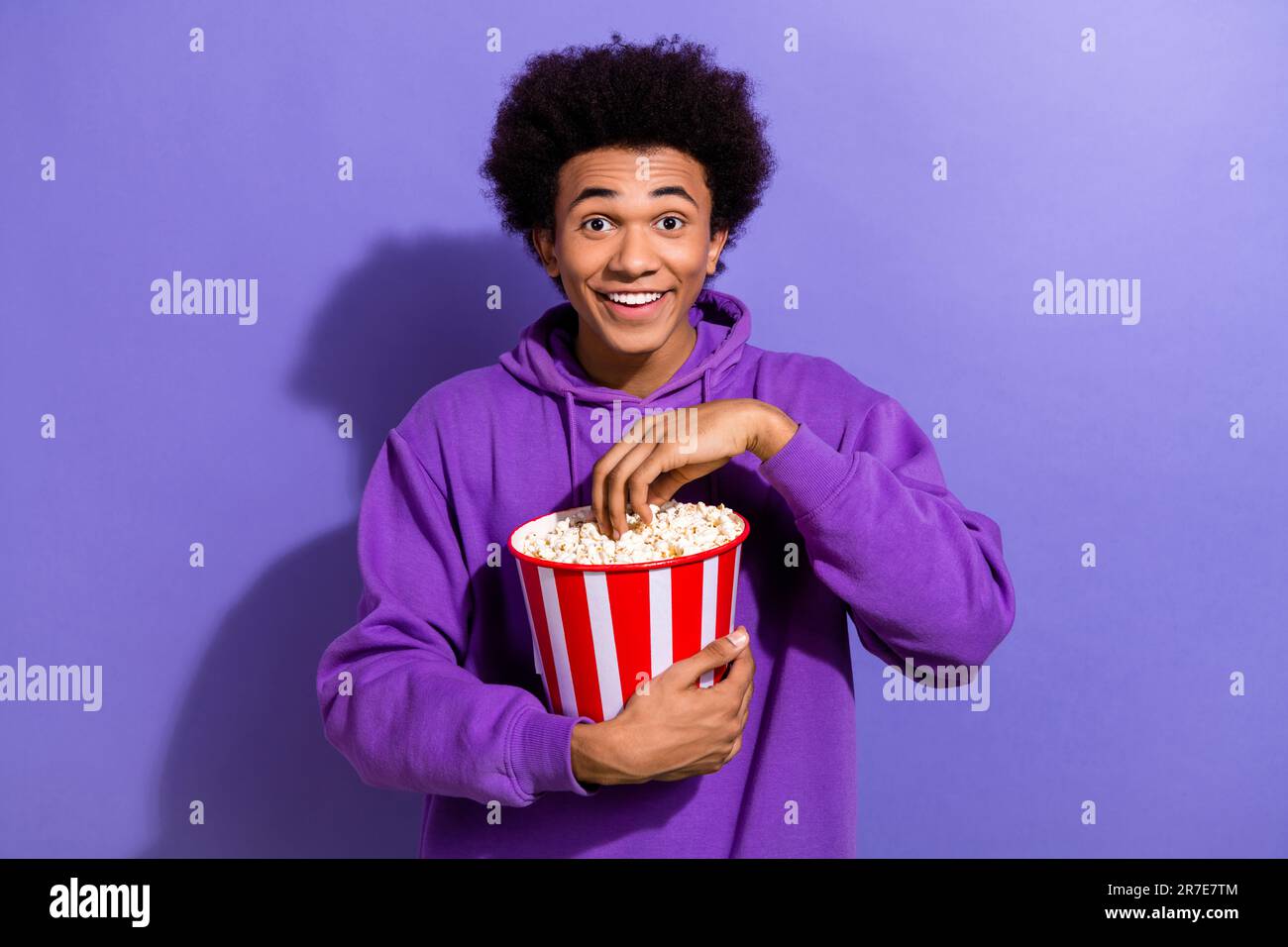 Portrait of cheerful nice person toothy smile eat popcorn enjoy new ...