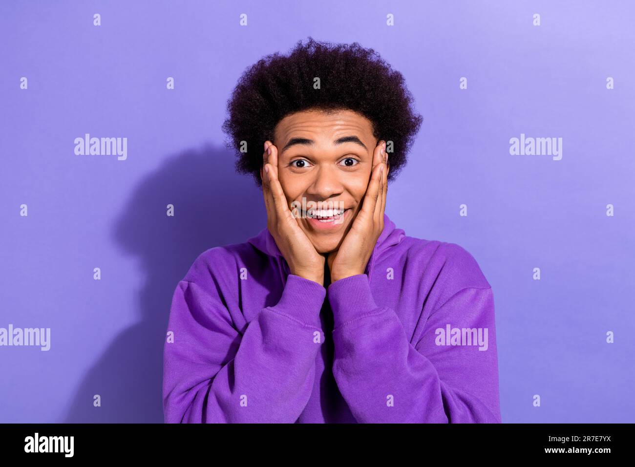 Portrait of youth man arms touch cheekbones impressed reaction shocked ...