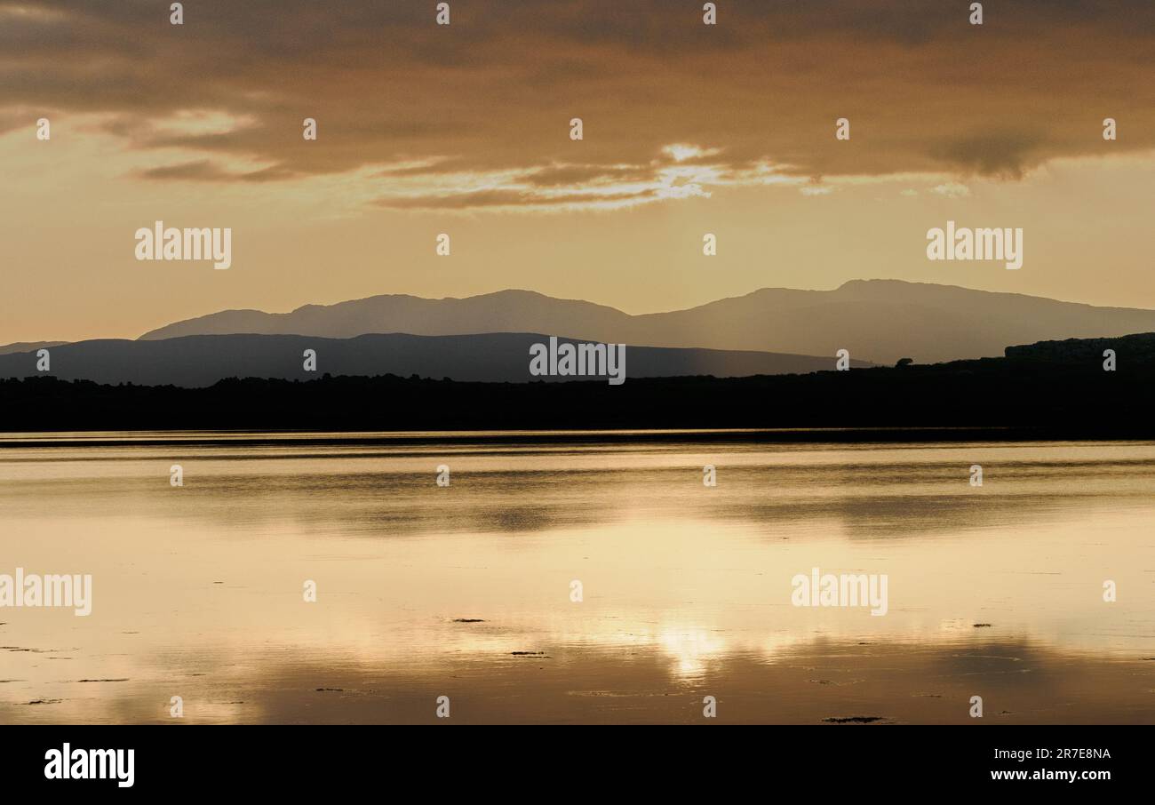 Sunset over calm sea hi-res stock photography and images - Alamy