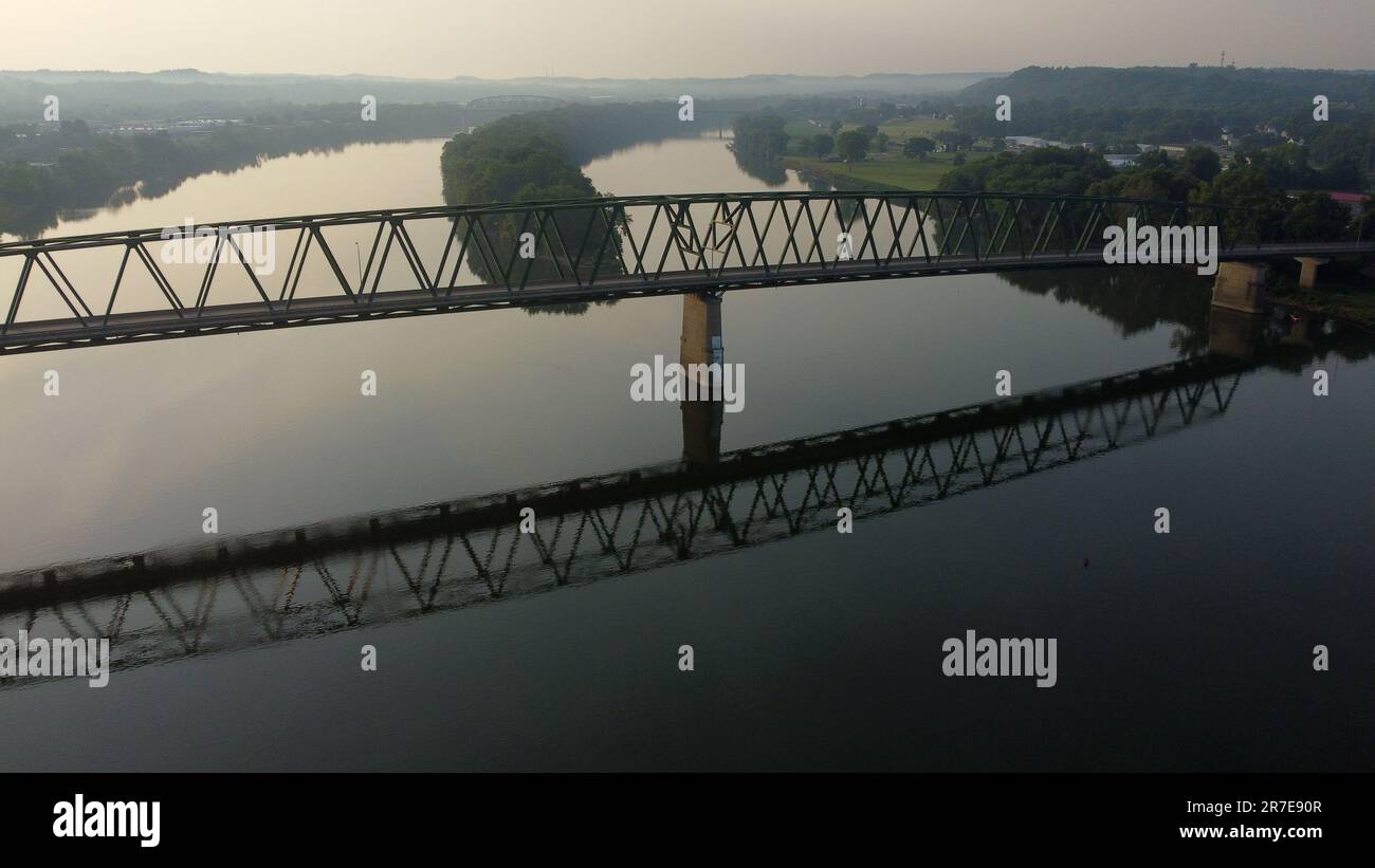 A stunning sunrise view of the Ohio River, with the sun glowing over ...