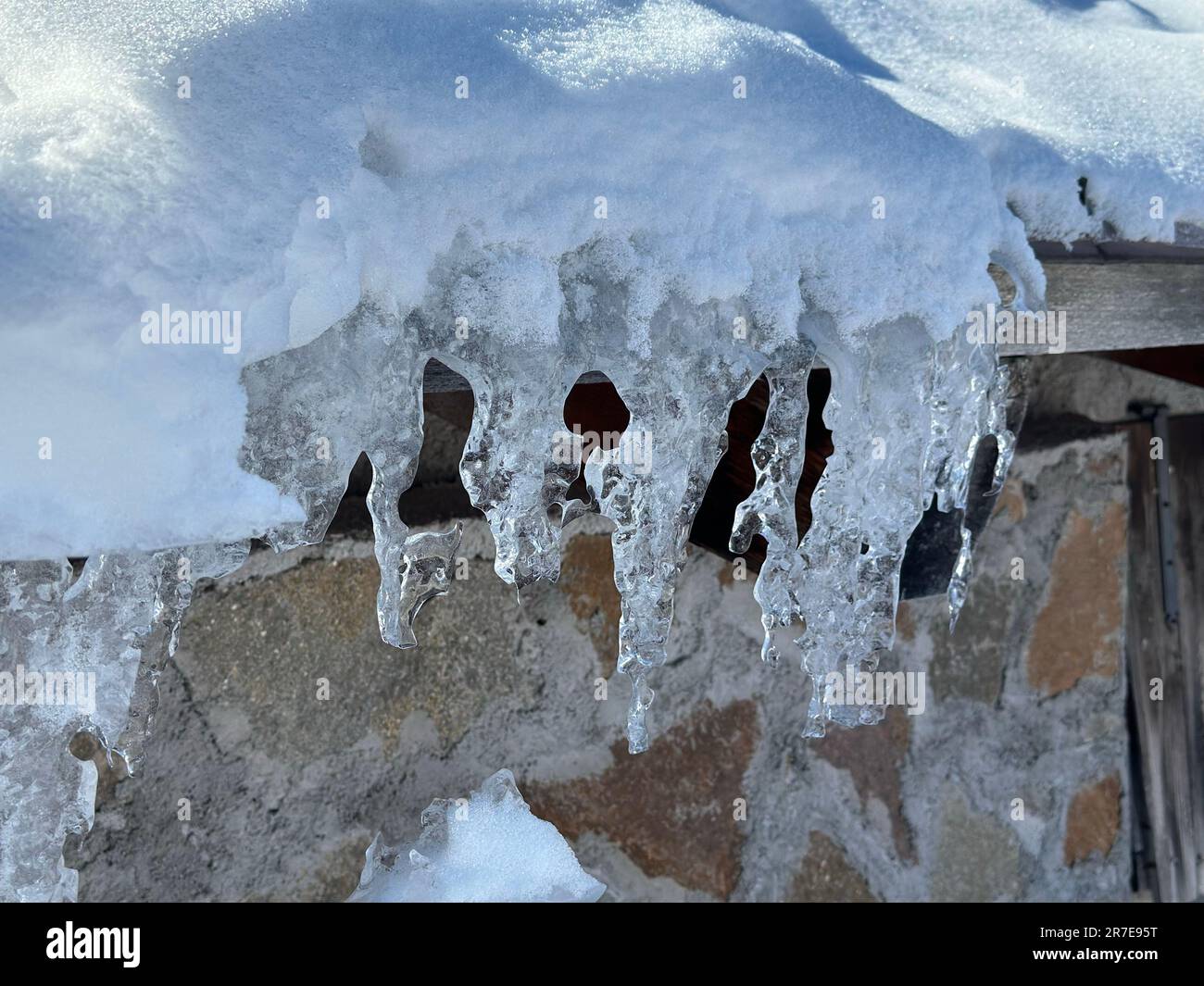 A decaying and abandoned structure featuring worn brick walls with ...
