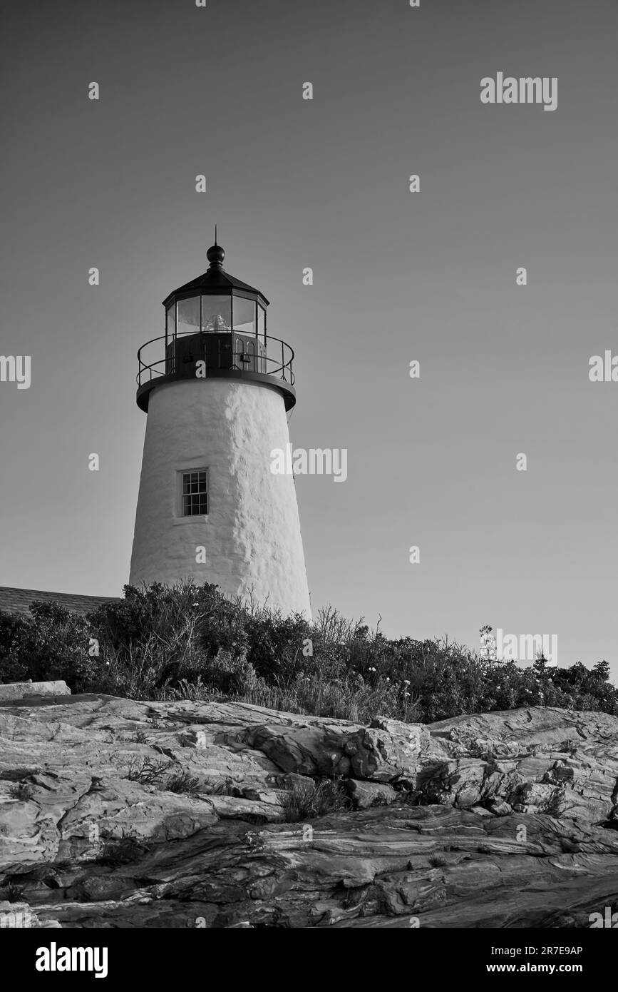 A grayscale of the Pemakid Point Lighthouse illuminated against a ...