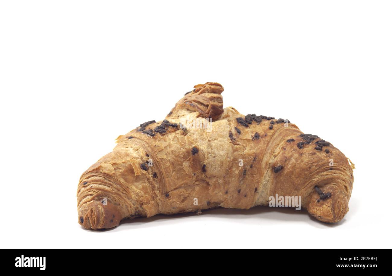 A freshly-baked croissant cut in half, showing its flaky layers and ...